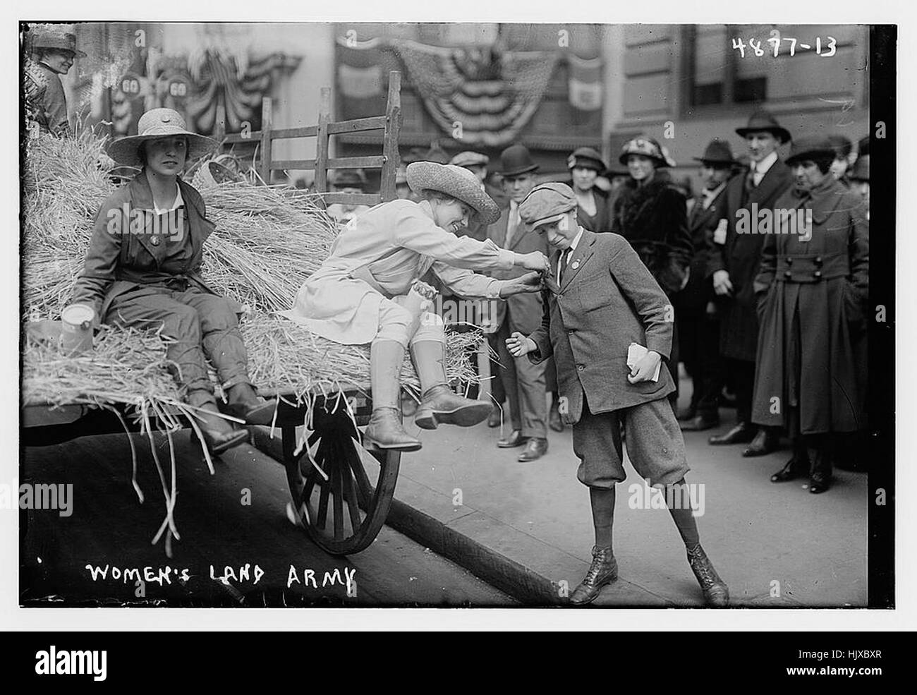 A historic photograph of women serving in the Women's Land Army during World War II, showing ...