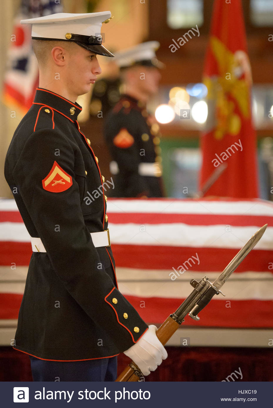The U.S. Marine Honor Guard conducts the Changing of the Guard ceremony for former astronaut and ...