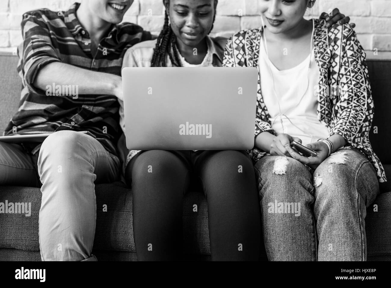 Diversity Friends Using Laptop Concept Stock Photo - Alamy