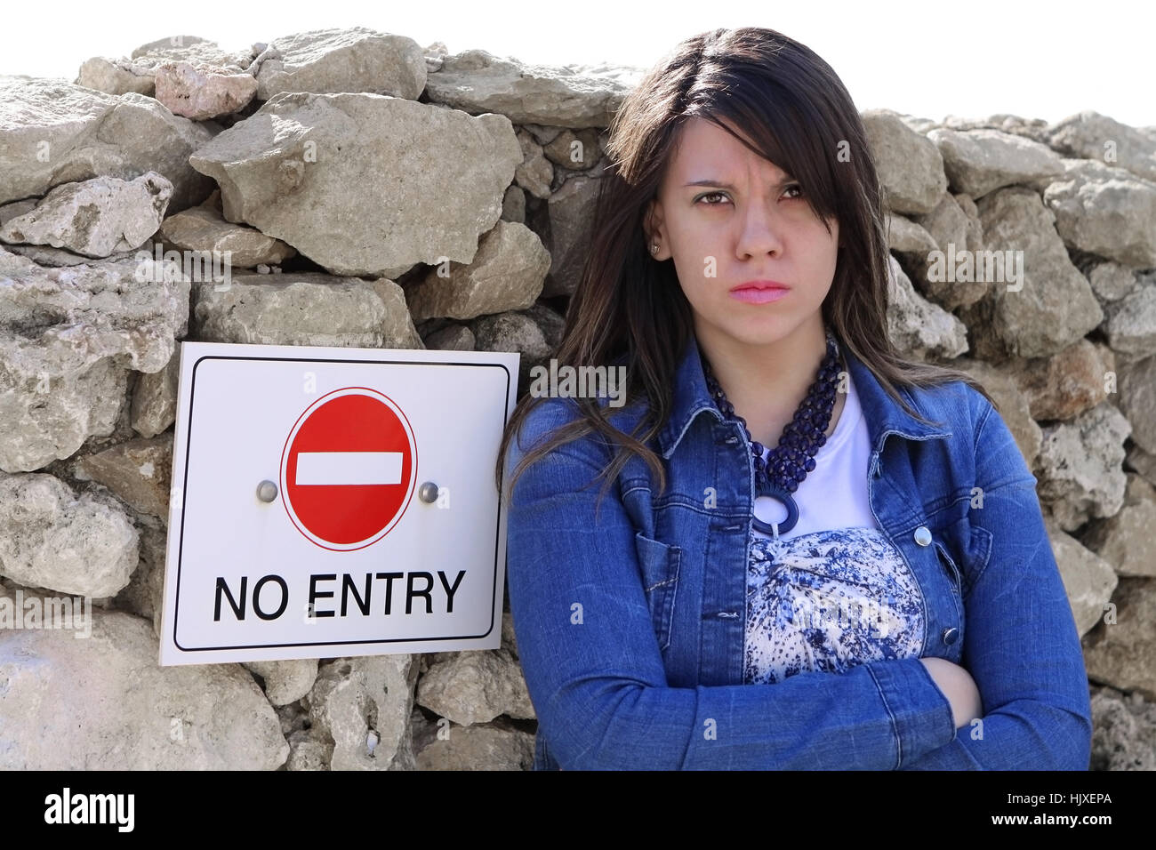 Cute upset girl standing by NO ENTRY sign, expandable white top for ...