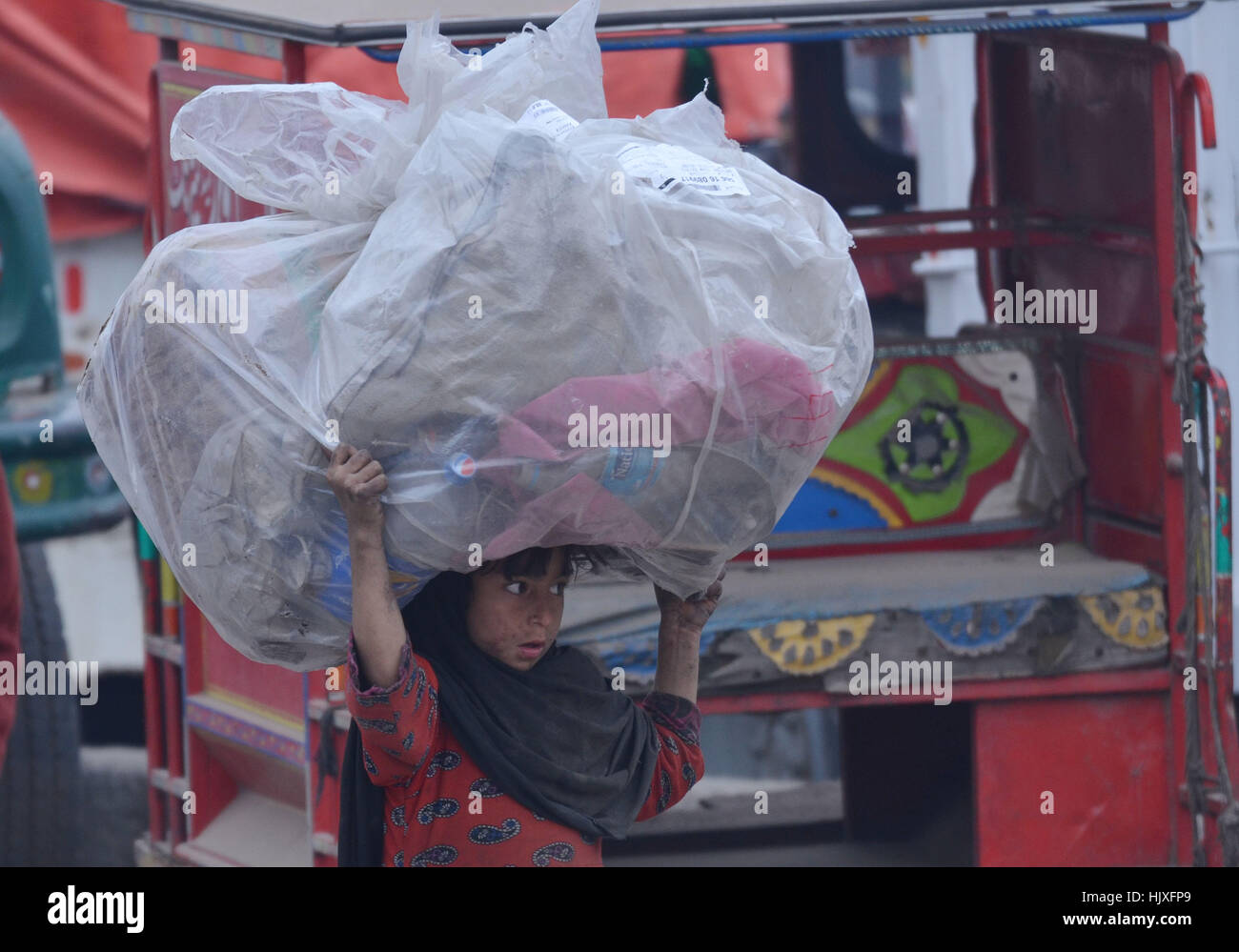 Lahore, Pakistan. 24th Jan, 2017. Pakistani people busy in their ...