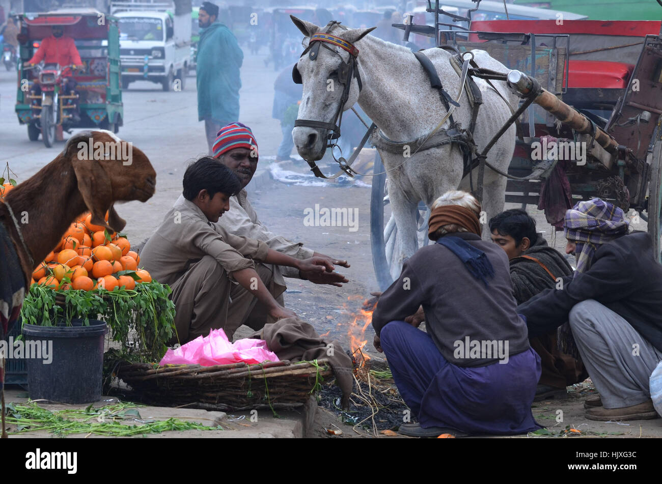Lahore, Pakistan. 24th Jan, 2017. Pakistani people busy in their ...