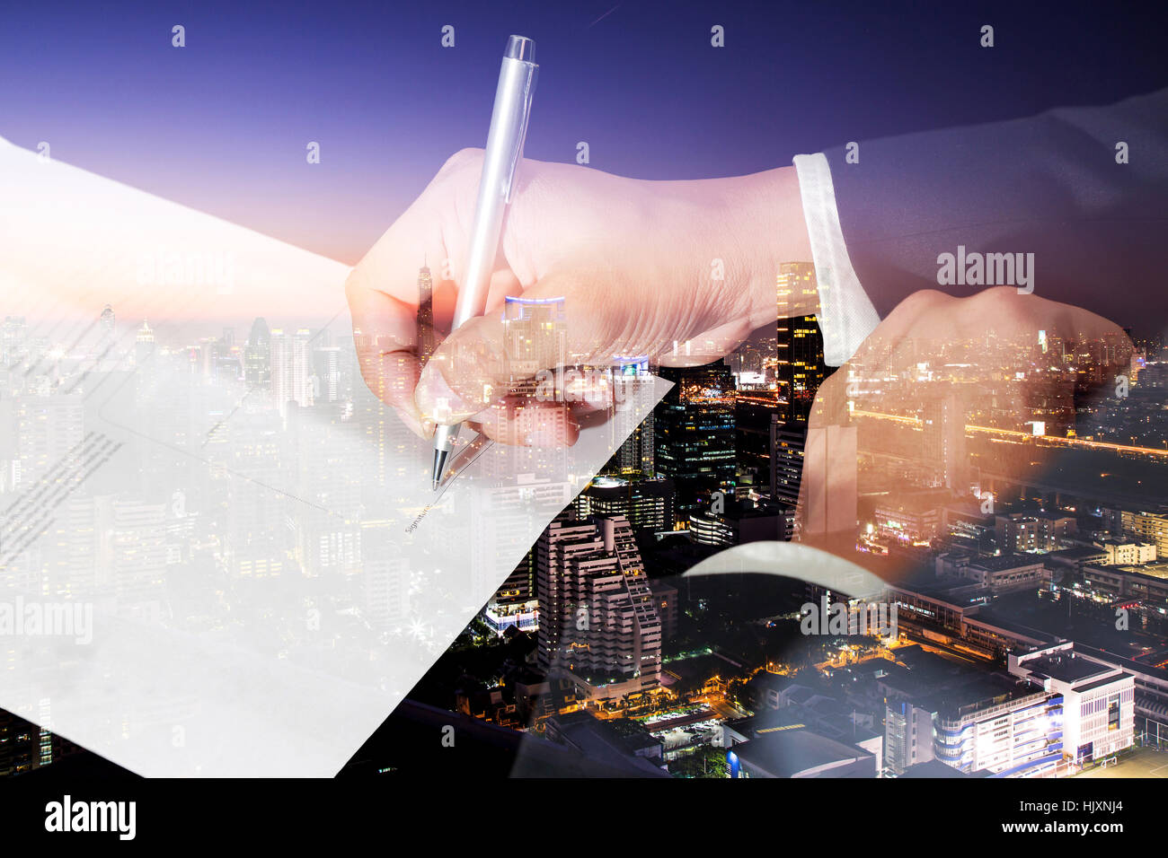 Double exposure of business man hand hold a pen signing the document or ...