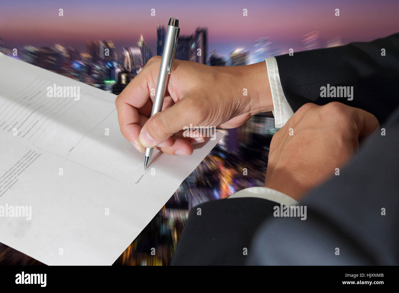 Businessman signing on document hi-res stock photography and images - Alamy