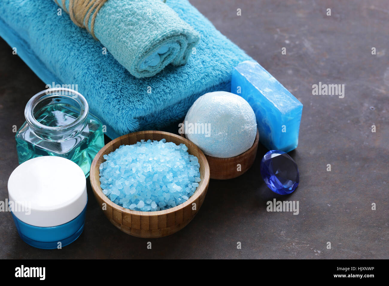 Spa concept turquoise - soap, salt, cream, towel Stock Photo - Alamy