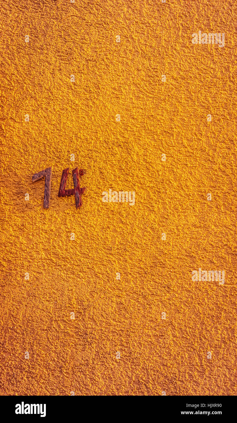 Rough orange background with the house number fourteen Stock Photo - Alamy