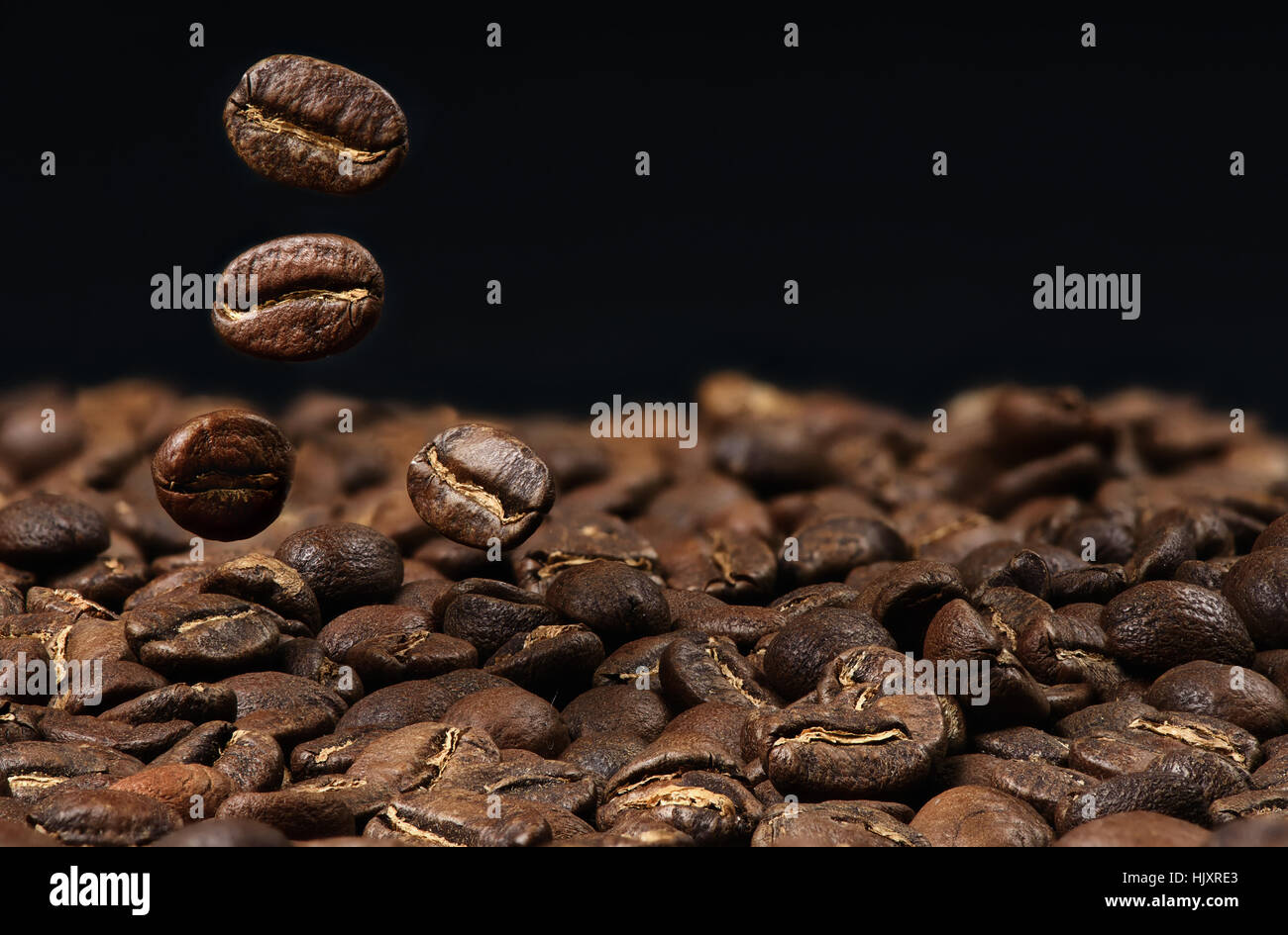 Black beans falling heap close hi-res stock photography and images - Alamy