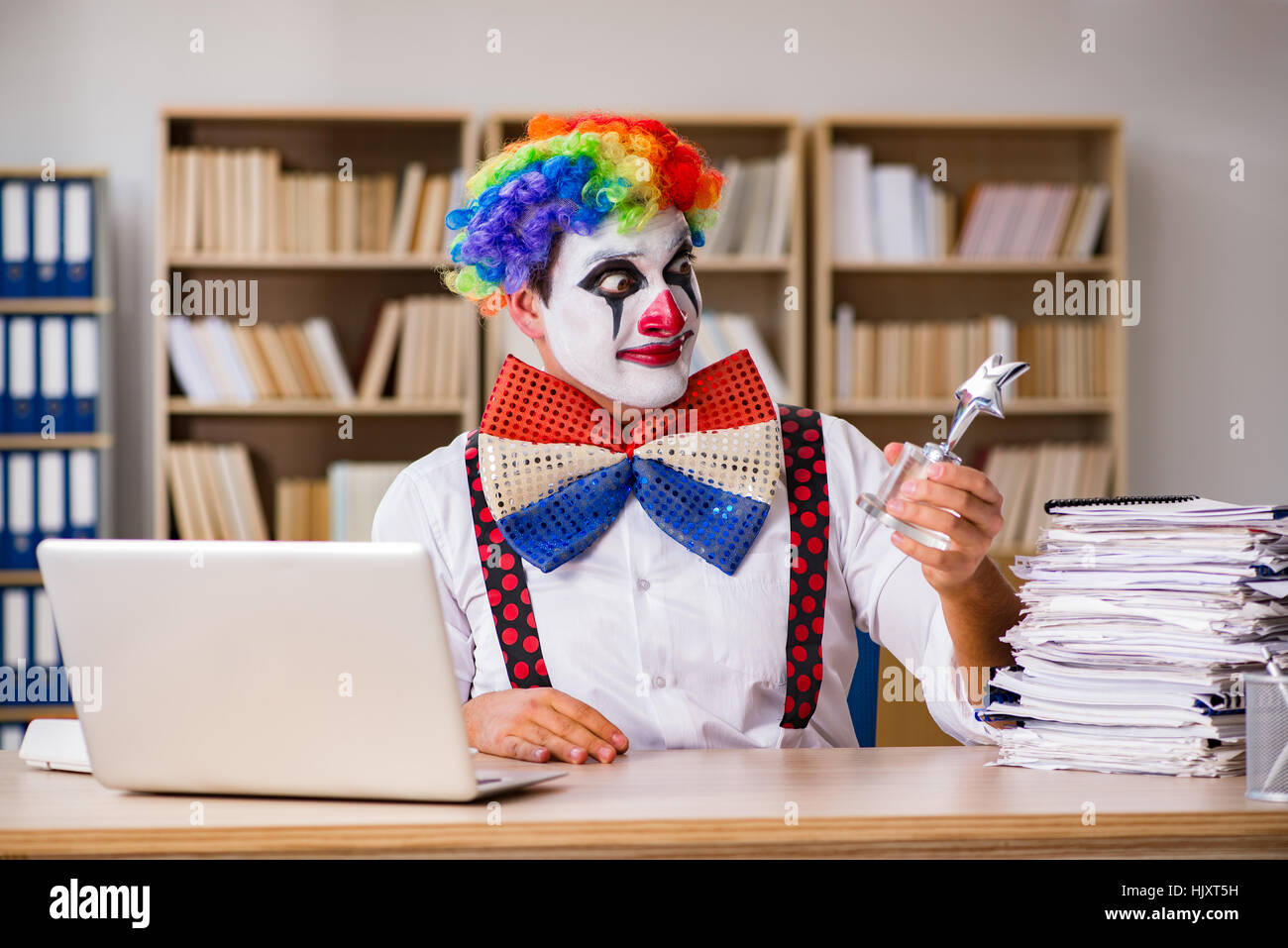 Clown businessman working in the office Stock Photo - Alamy