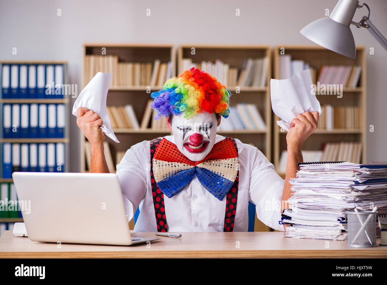 Clown businessman working in the office Stock Photo - Alamy