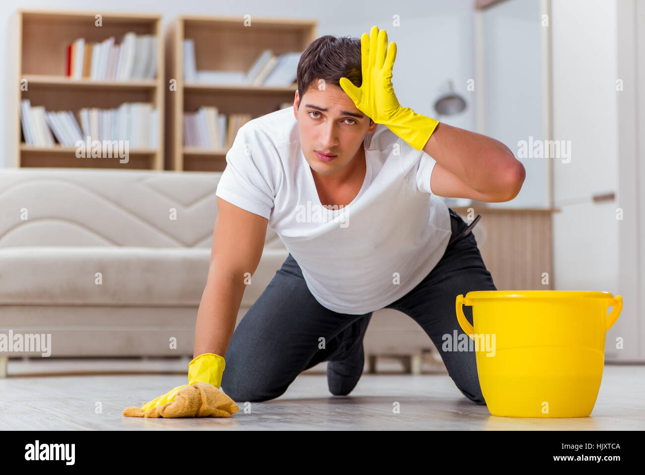 Man husband cleaning the house helping wife Stock Photo - Alamy