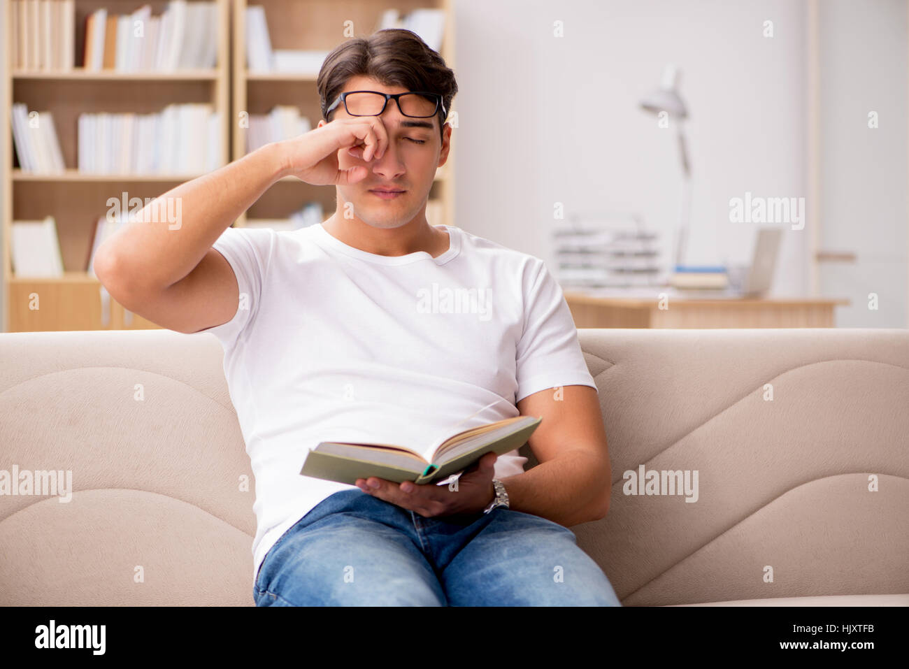 Man student boring reading book hi-res stock photography and images - Alamy