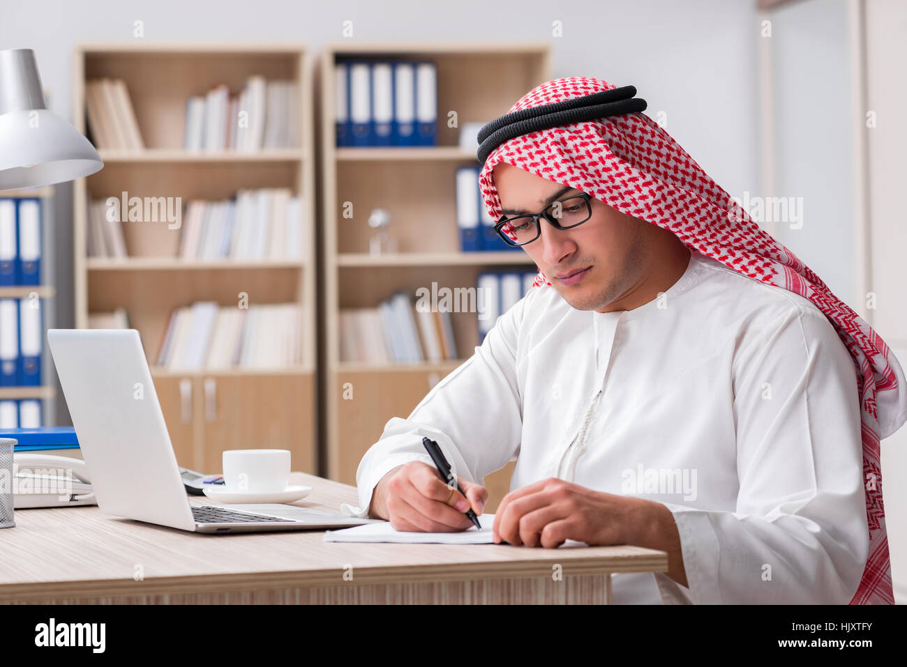Arab businessman working in the office Stock Photo - Alamy