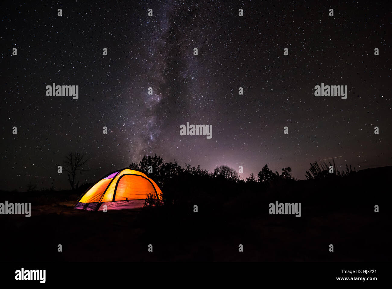Small Orange Tent under the Milky Way Stock Photo - Alamy