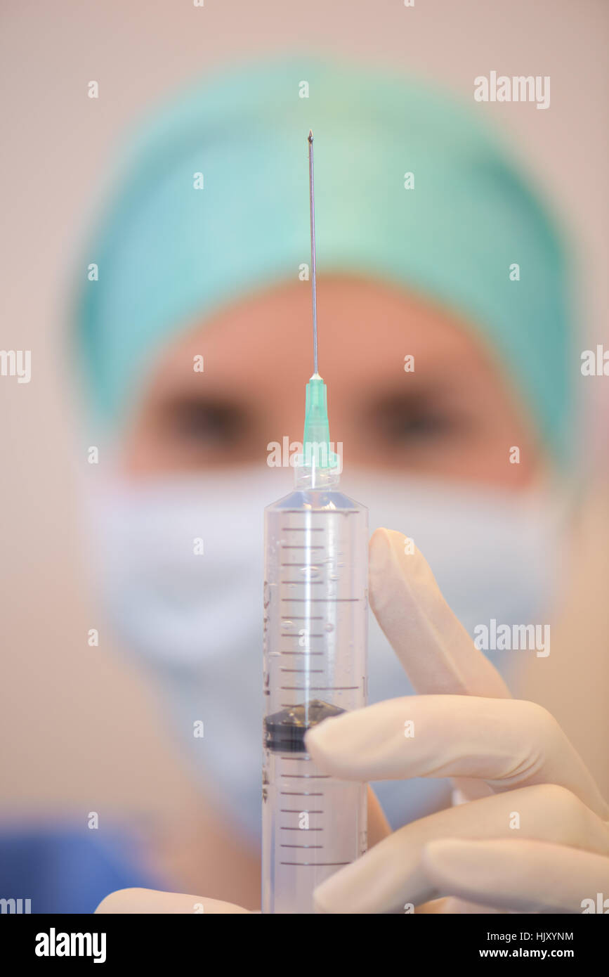 doctor and needle Stock Photo - Alamy