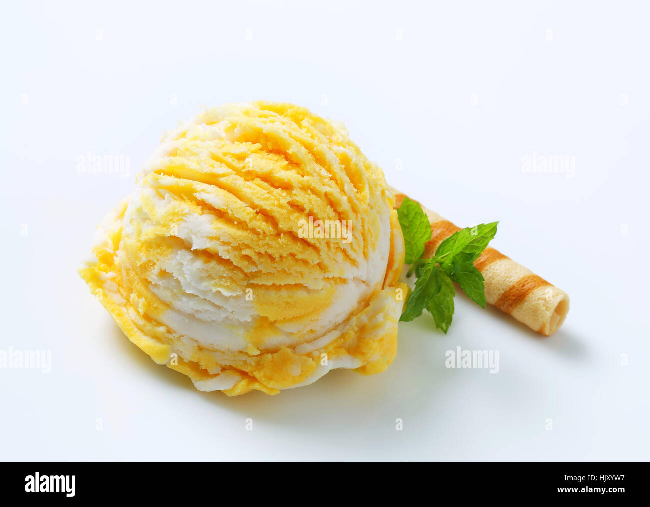 Scoop of yellow white ice cream Stock Photo - Alamy