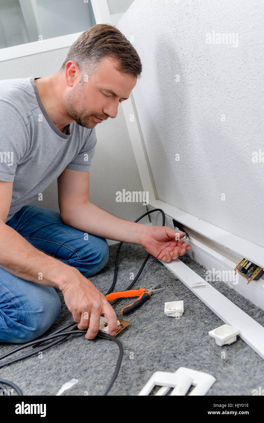 Fixing broken electrical socket hi-res stock photography and images - Alamy