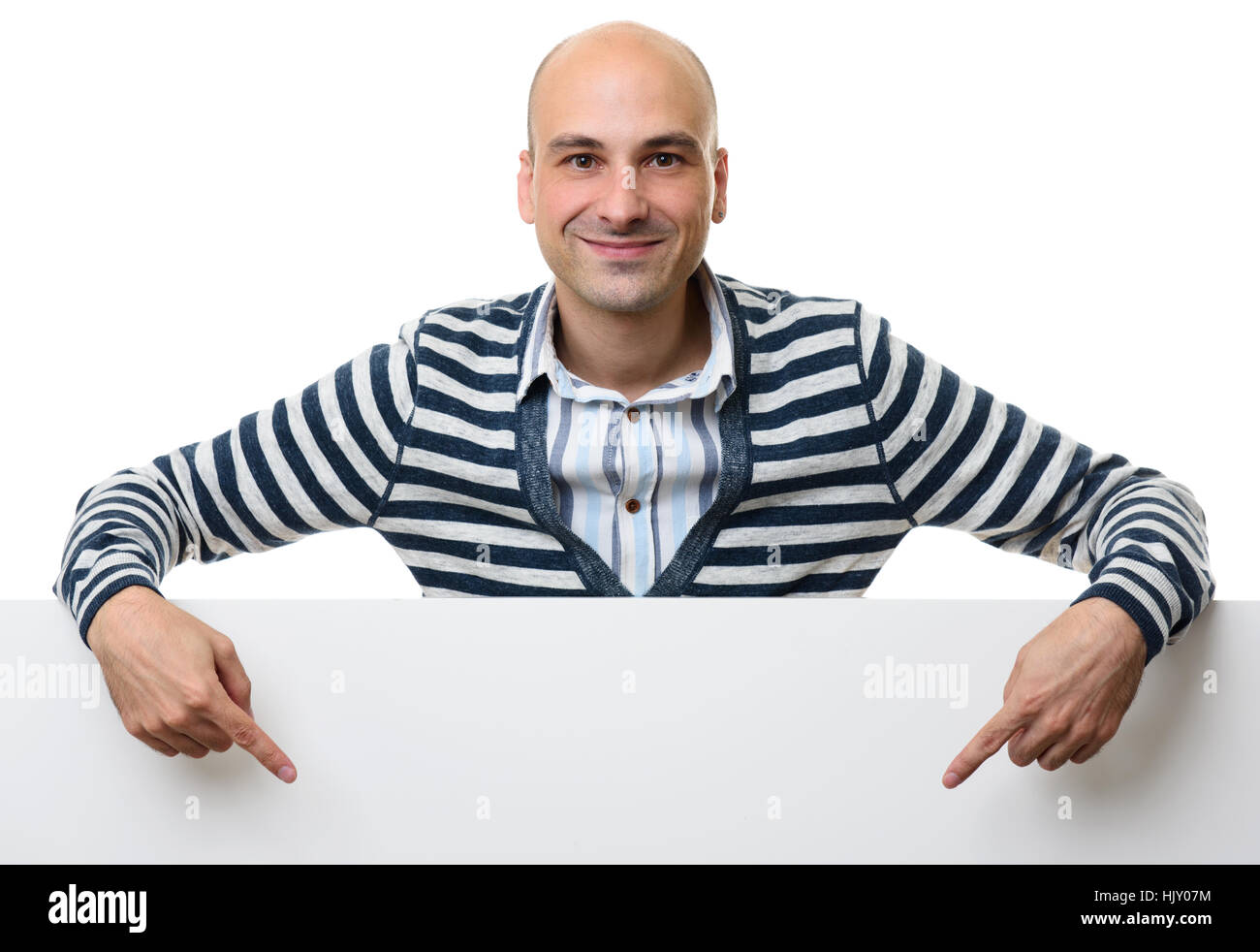Portrait of happy man with blank advertising board or copy space ...