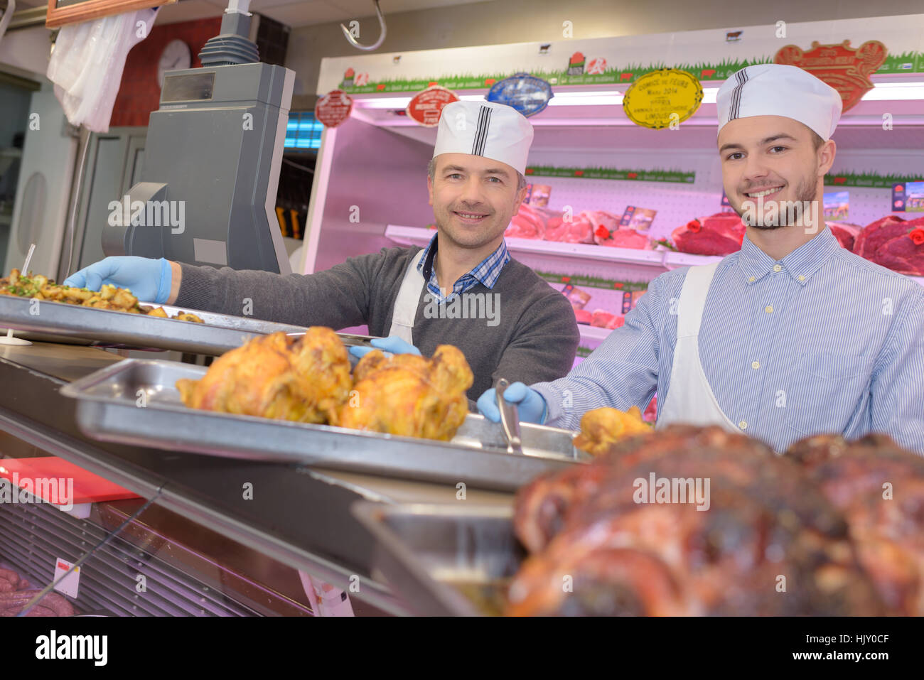 Portrait of team of butchers Stock Photo - Alamy