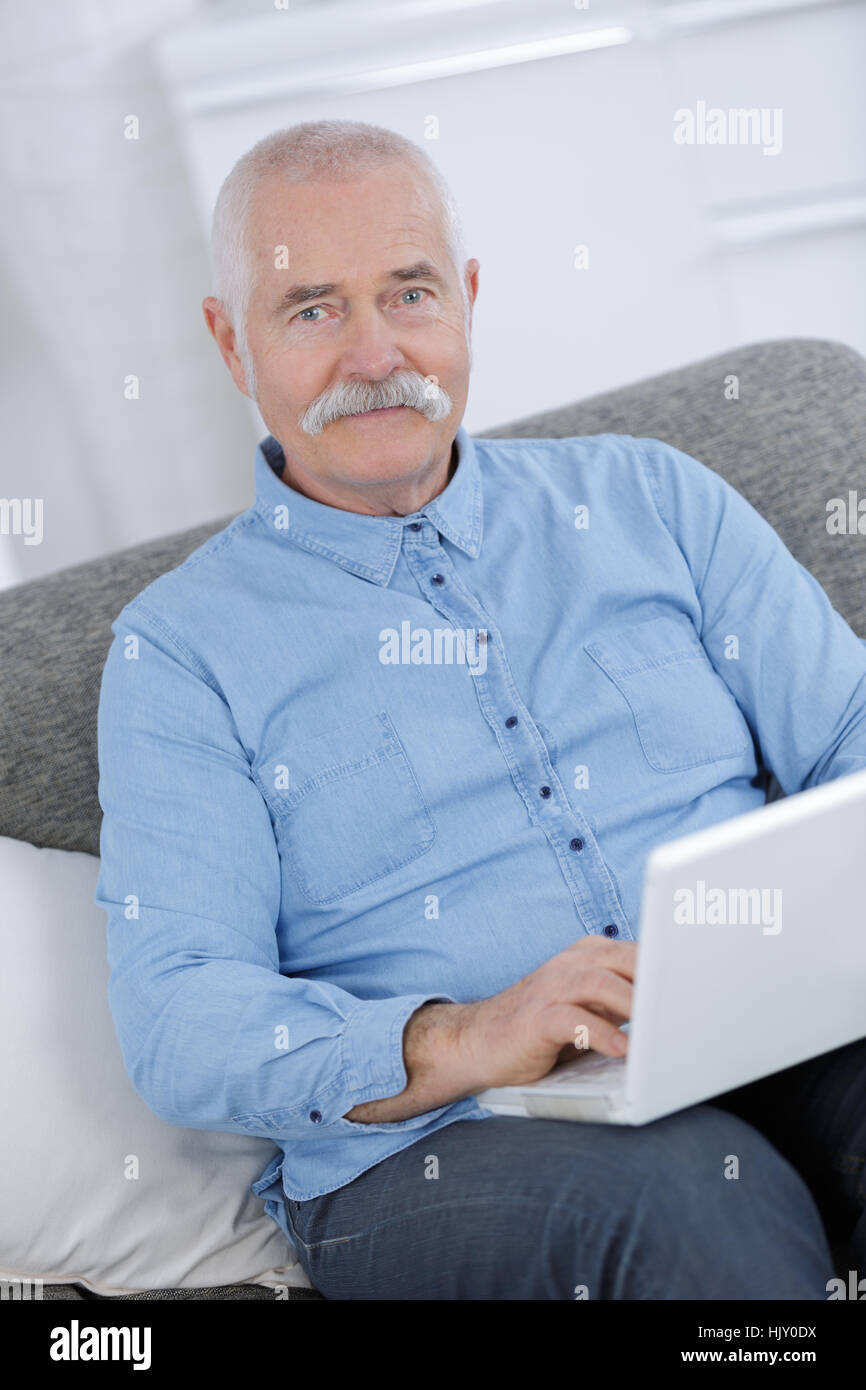 happy senior man with laptop Stock Photo - Alamy