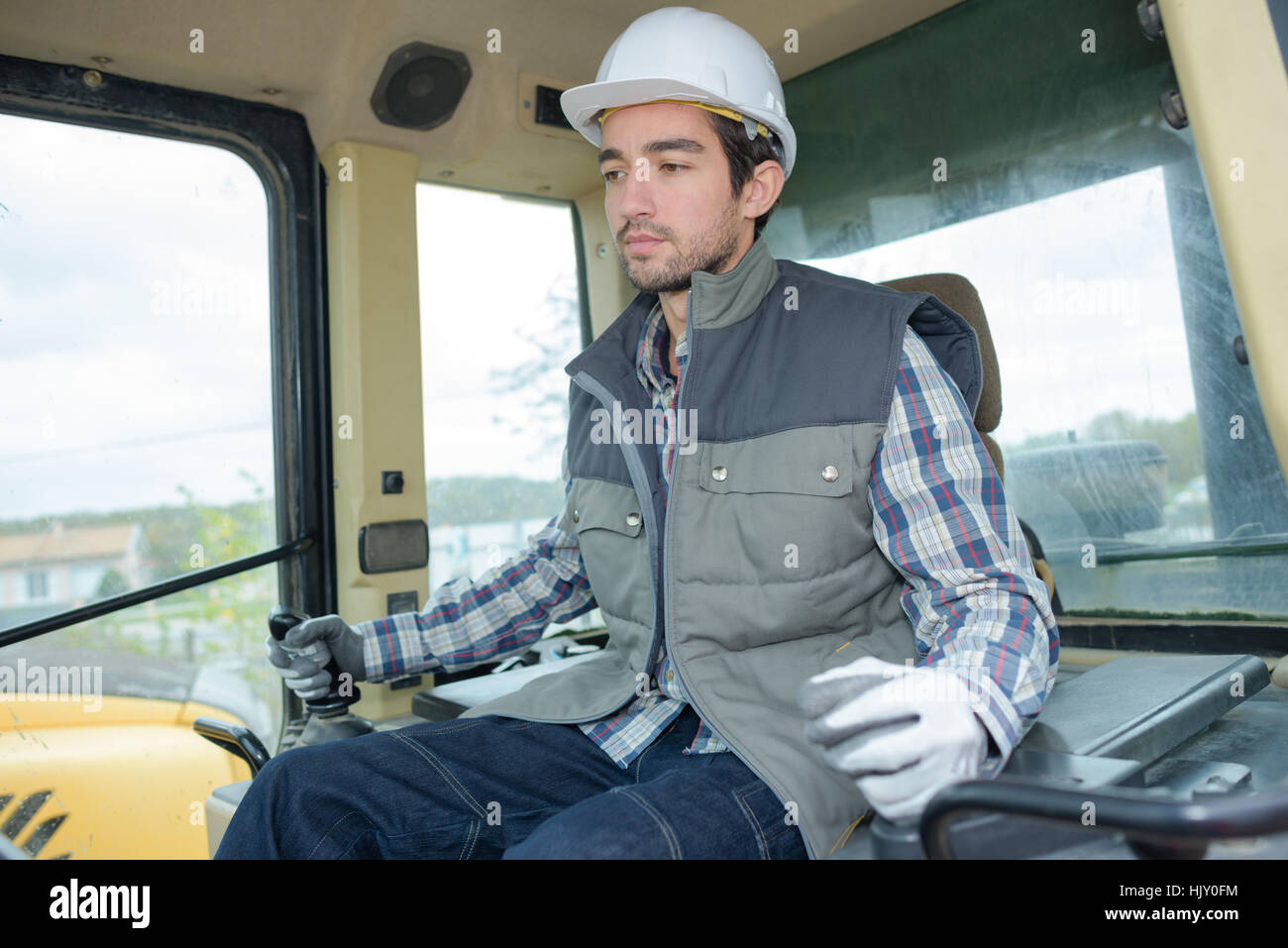 Man driving digger hi-res stock photography and images - Alamy