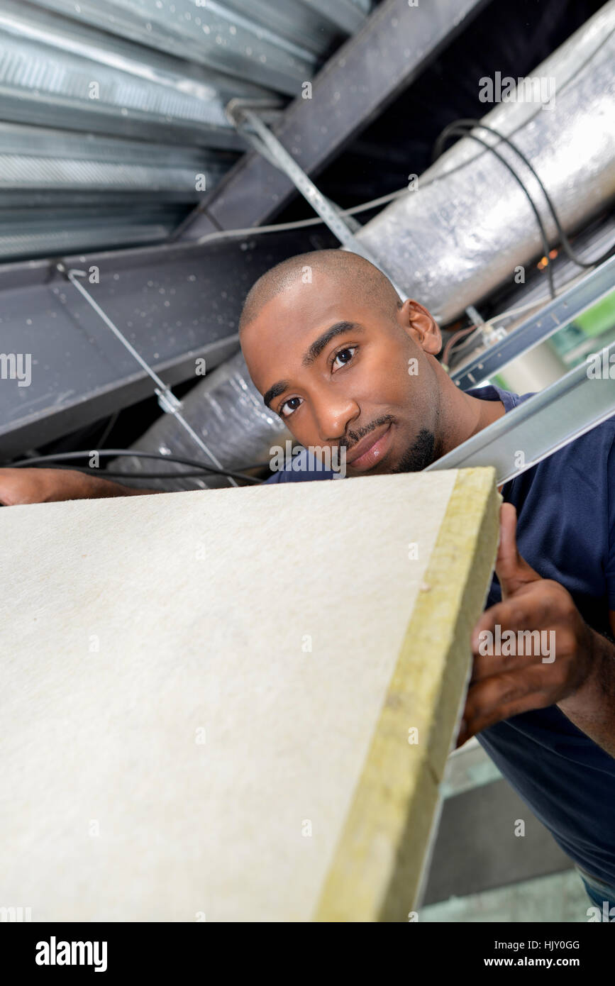 man installing ceiling Stock Photo - Alamy