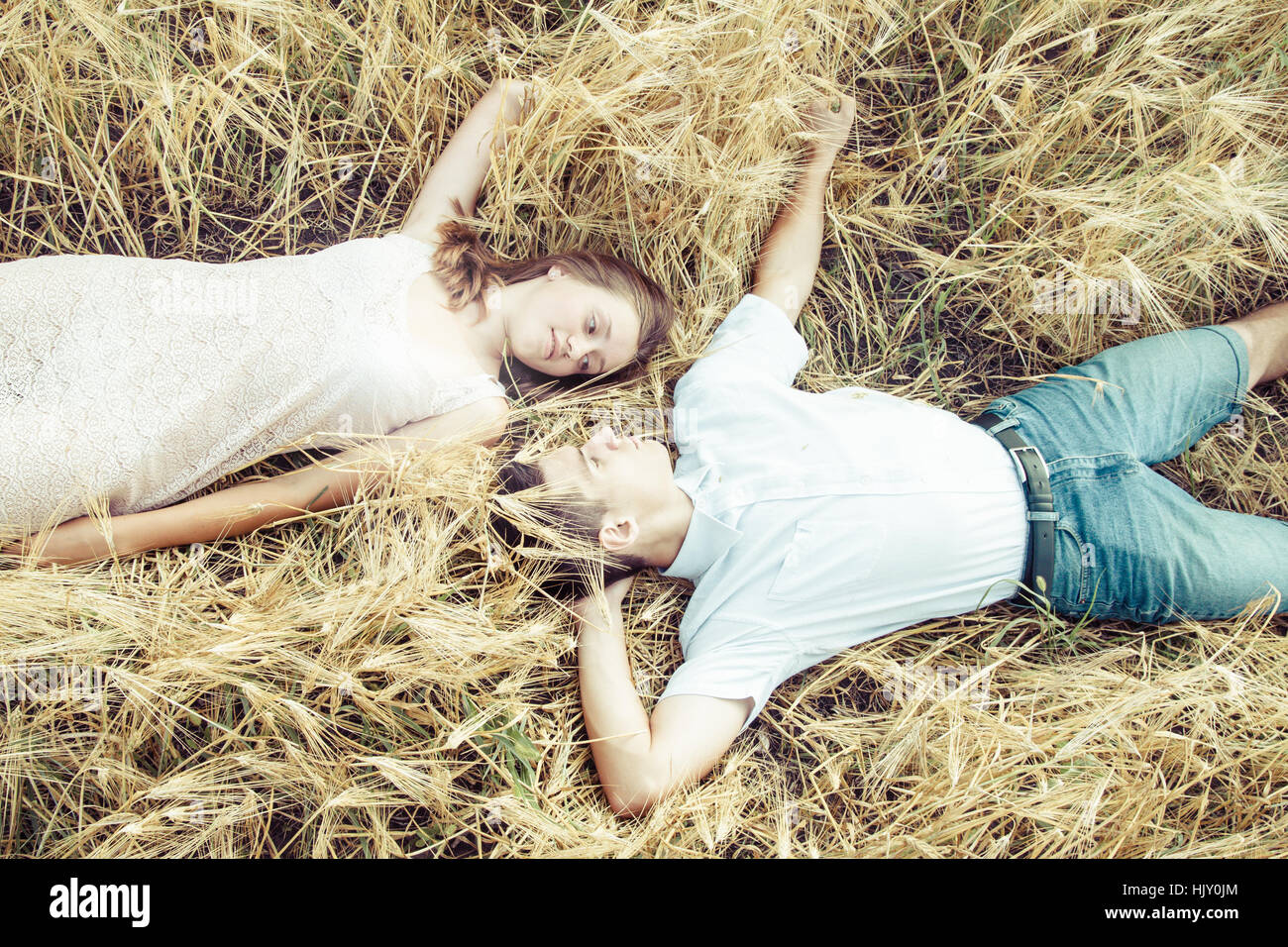 Teen girl lying on field hi-res stock photography and images - Alamy