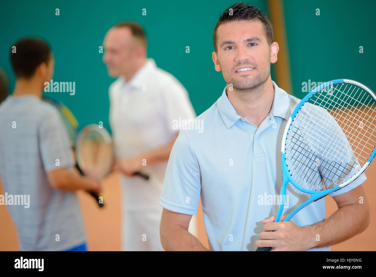 Portrait of male tennis player Stock Photo - Alamy