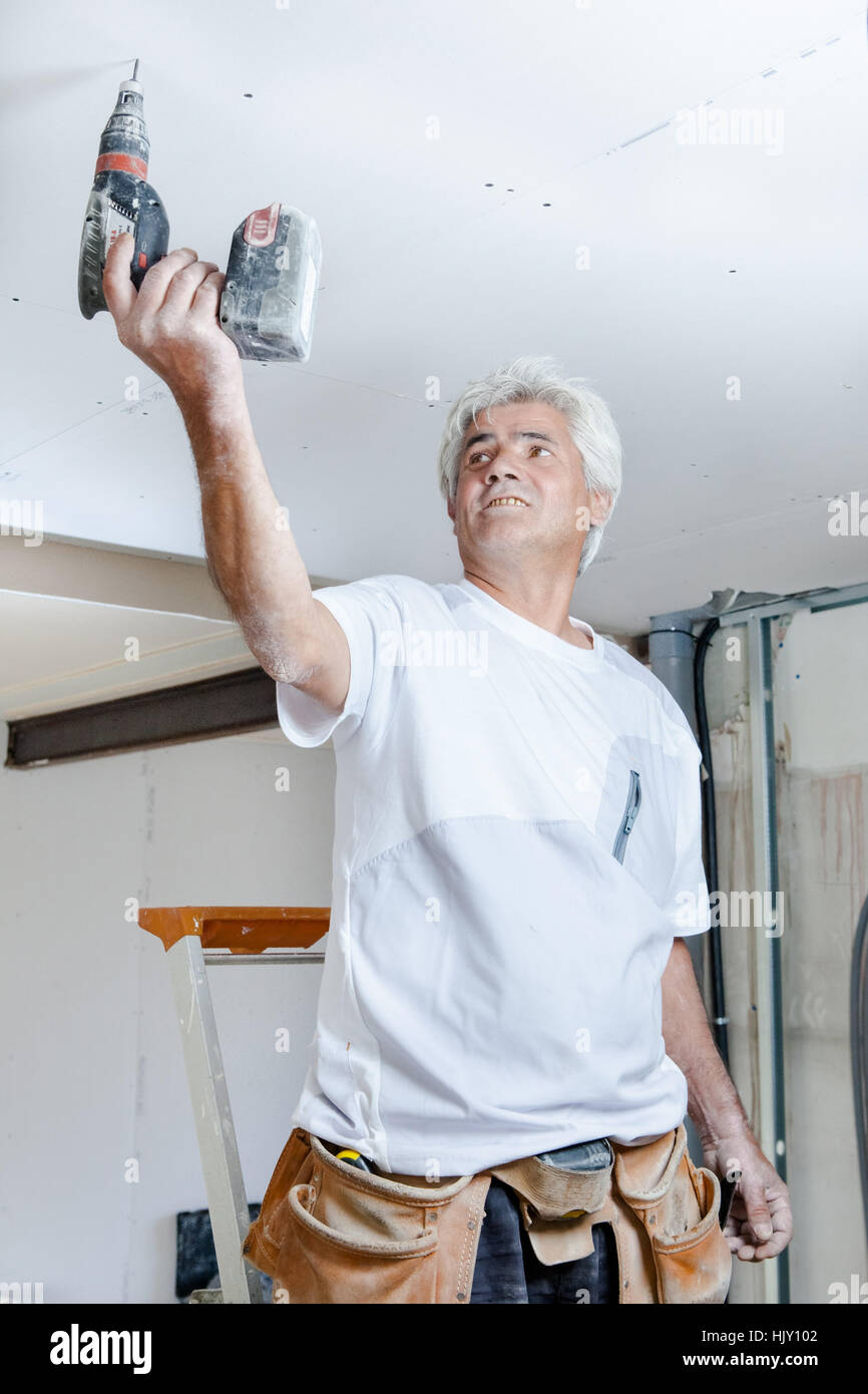 drilling the ceiling Stock Photo - Alamy