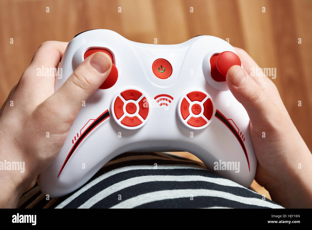 Child hands use remote control of drone Stock Photo - Alamy