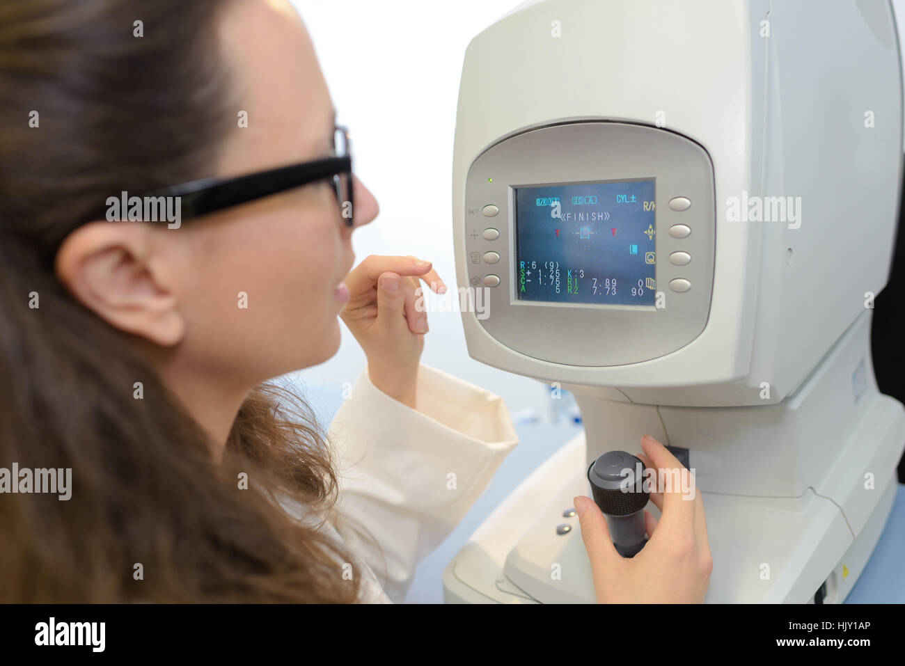 Nurse using diagnostic equipment Stock Photo - Alamy