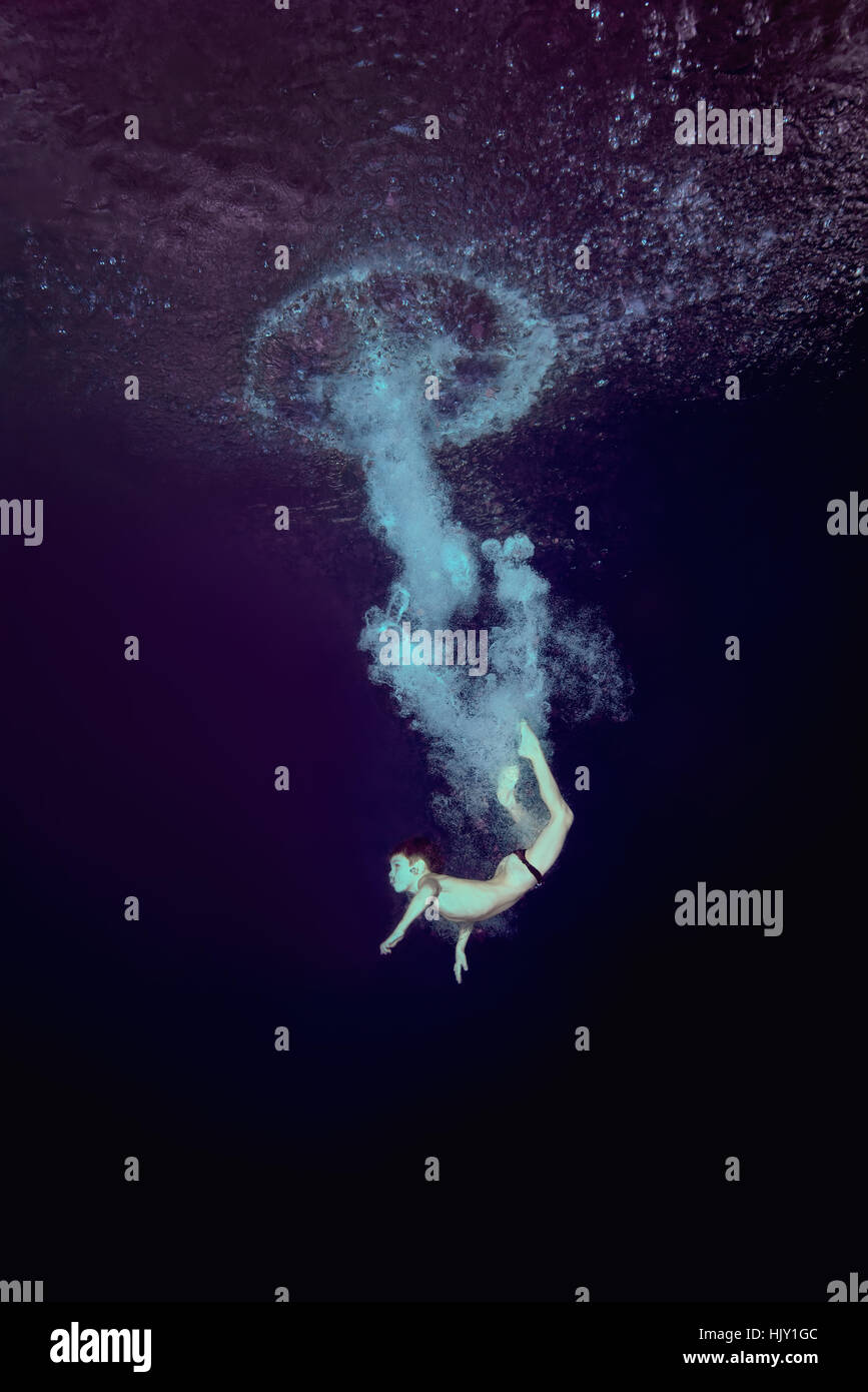 Underwater view - Boy jumping down in the pool (Diving sport) Nikolaev ...