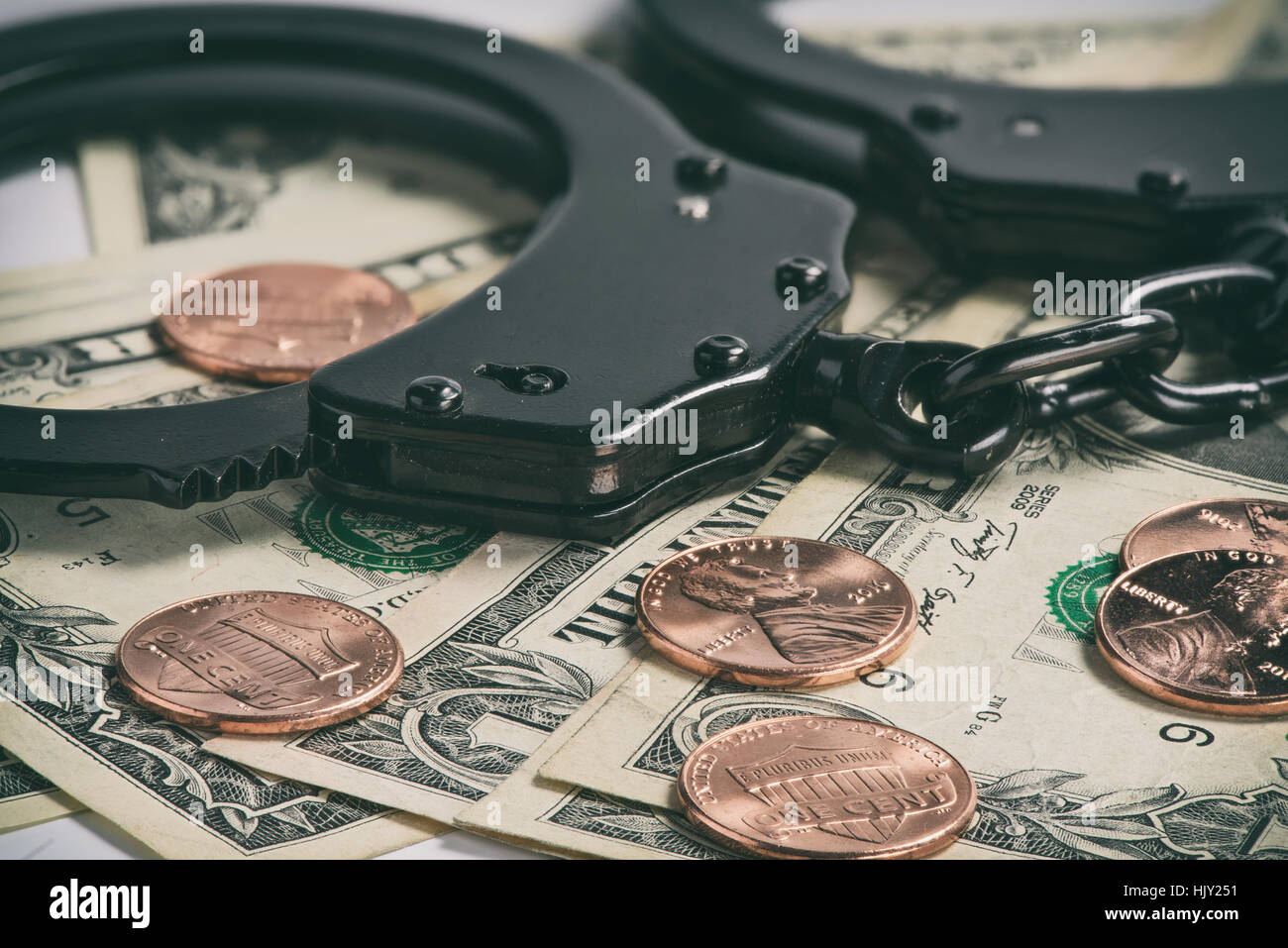 Handcuffs on money. American dollars. crime concept Stock Photo - Alamy