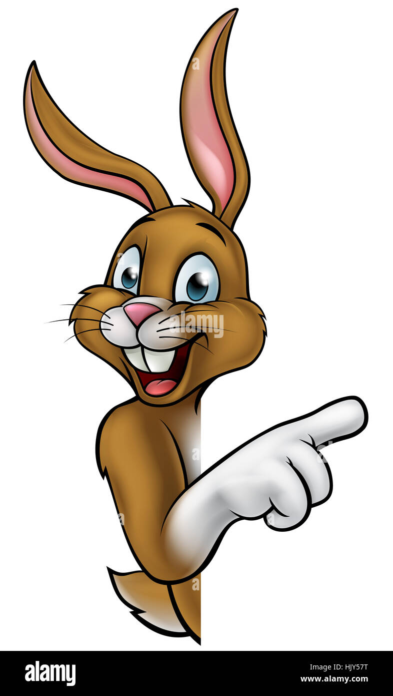 A cartoon Easter bunny or rabbit pointing Stock Photo - Alamy