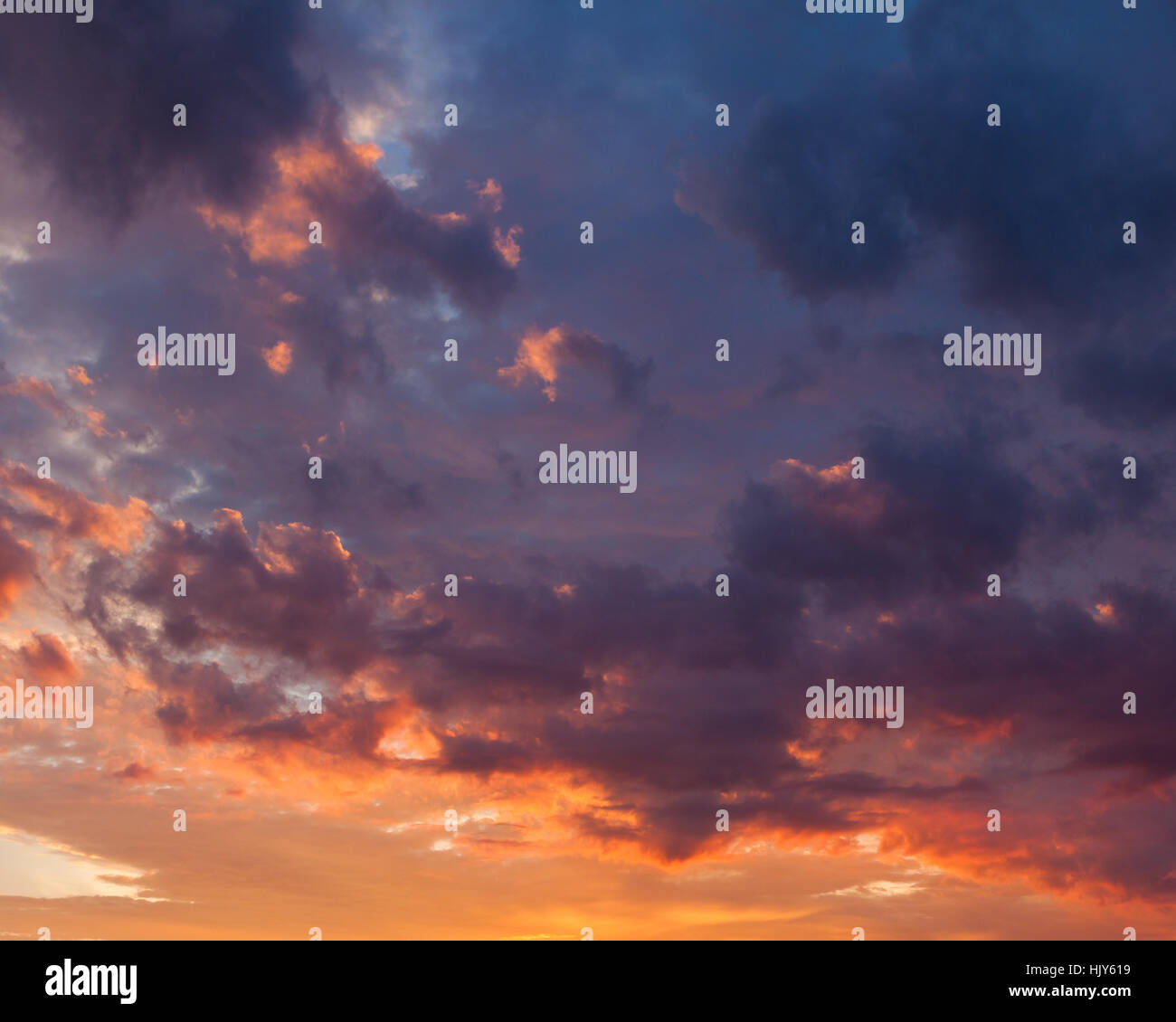 Fiery vivid sunset sky clouds Stock Photo - Alamy