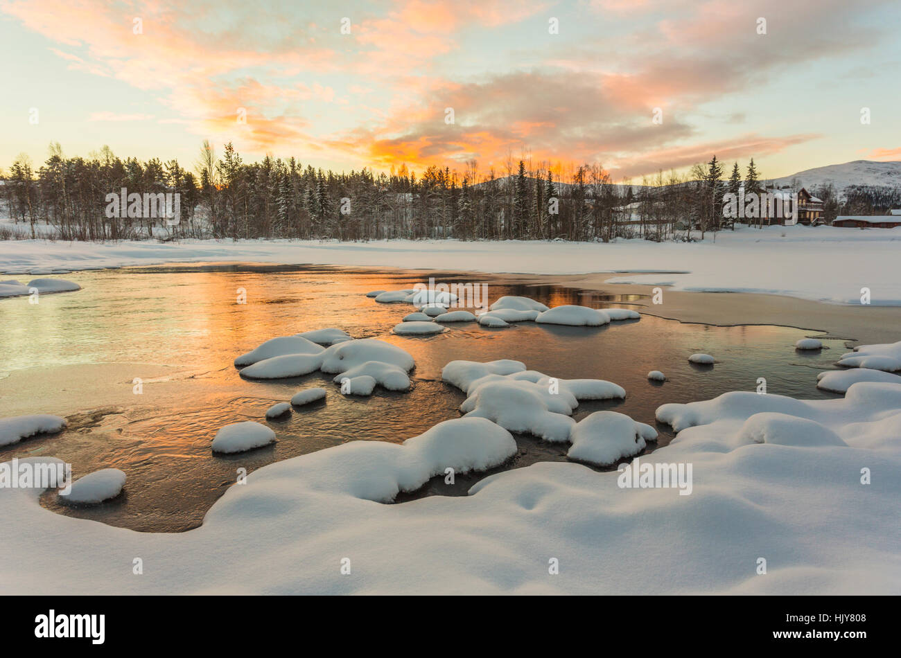 Wassara river with colorful sky at sunset reflecting in the water with ...