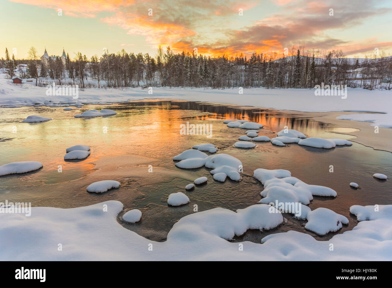 Wassara river with colorful sky at sunset reflecting in the water with ...