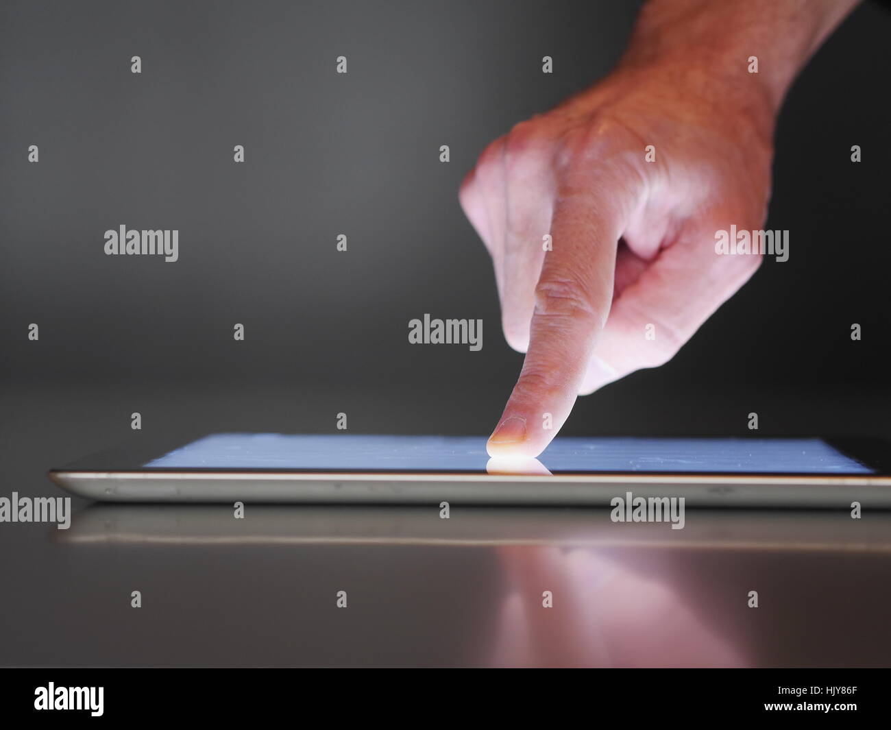 Closeup hand touching tablet screen hi-res stock photography and images ...