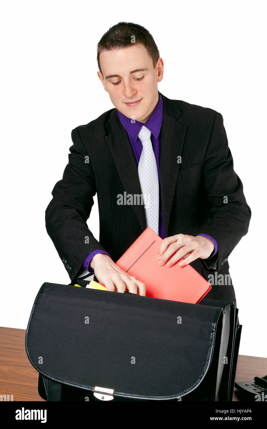 businessman grabs briefcase Stock Photo - Alamy