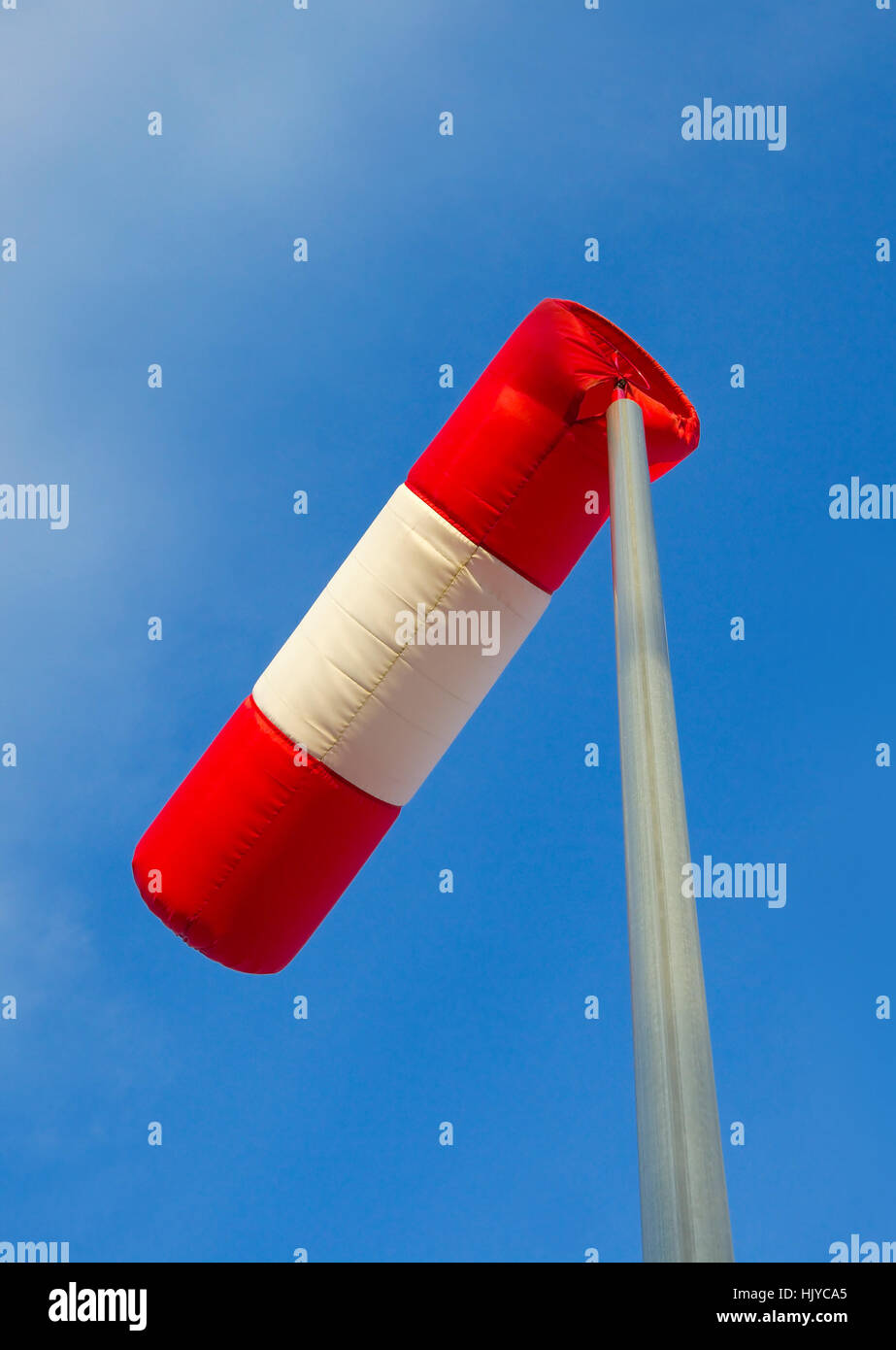 Windsock against clear blue sky Stock Photo - Alamy