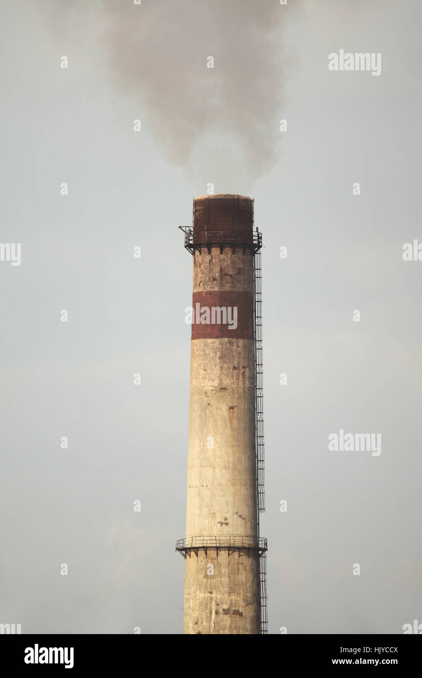 Smoking chimney of an industrial plant Stock Photo - Alamy