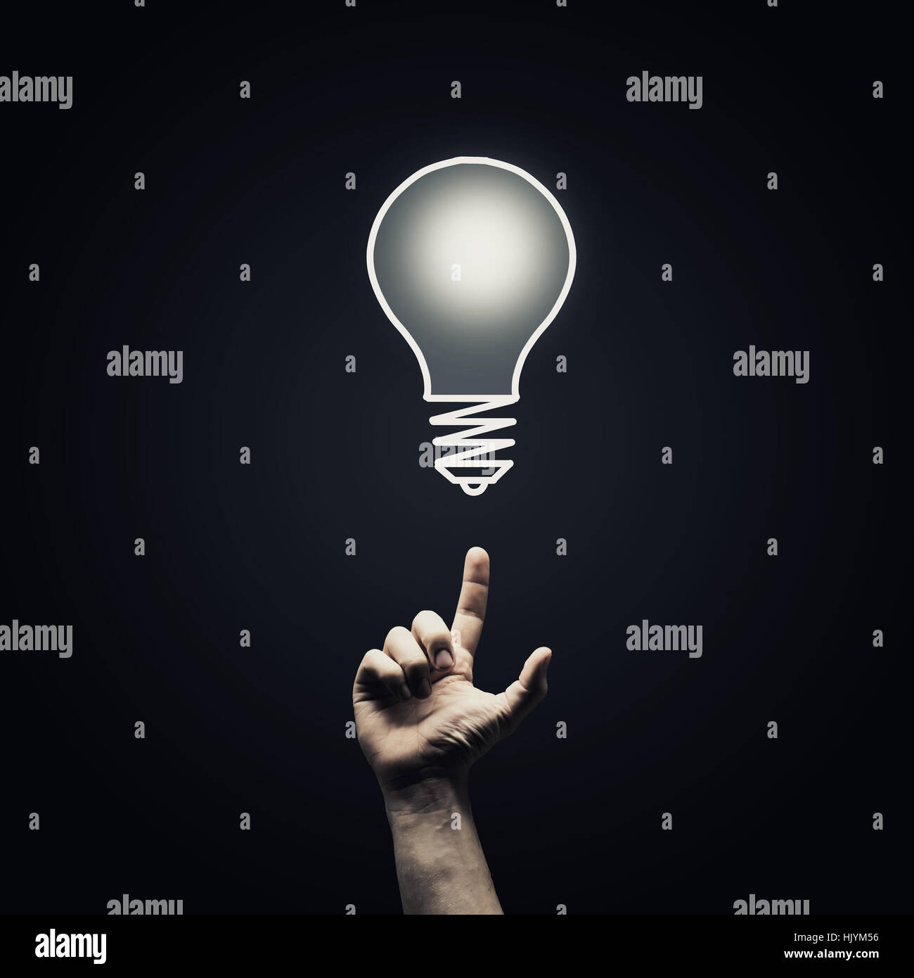 Human hand pointing with finger at light bulb Stock Photo - Alamy