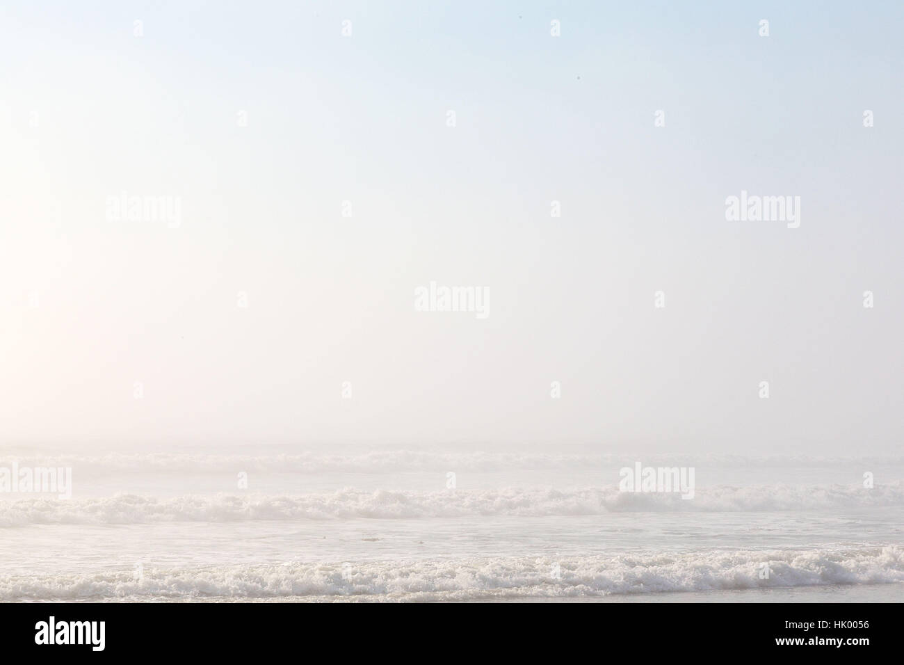 rolling waves through misty sunlight Stock Photo - Alamy