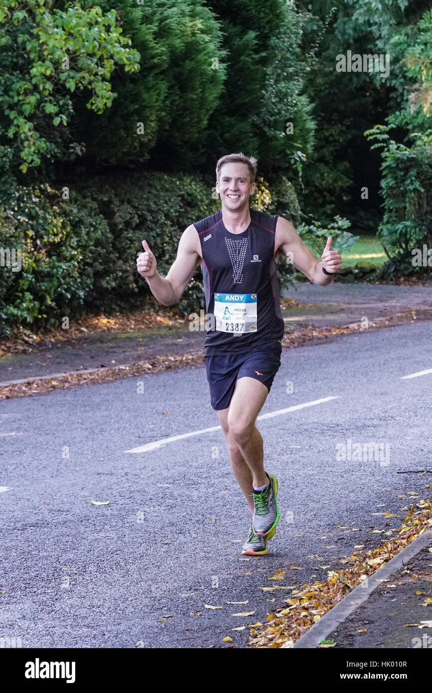 A runner gives a thumbs up in the Chester Marathon Stock Photo - Alamy
