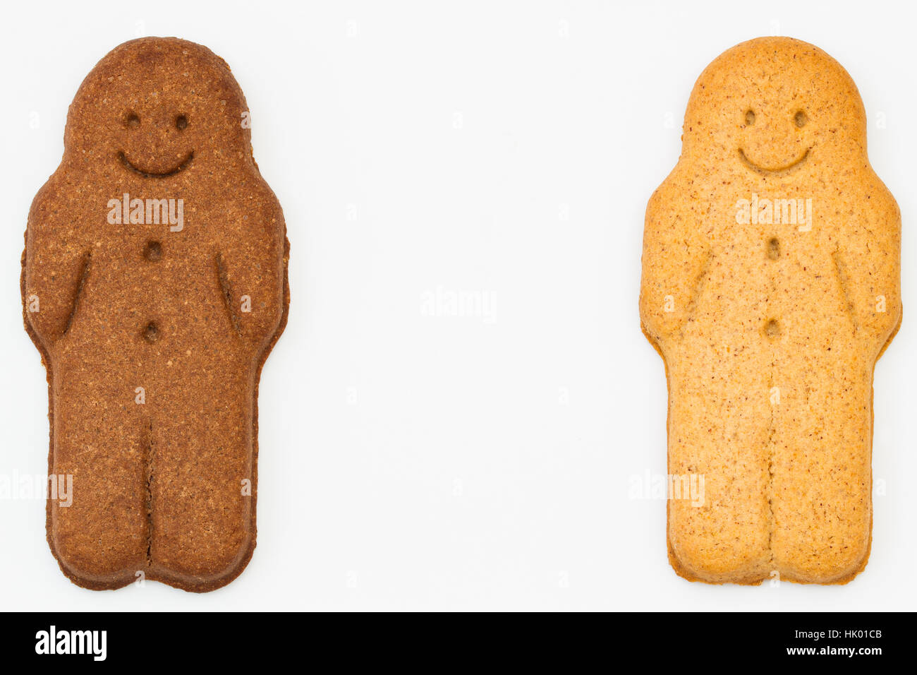 Rows of happy and smiling, black and white gingerbread men on a white ...