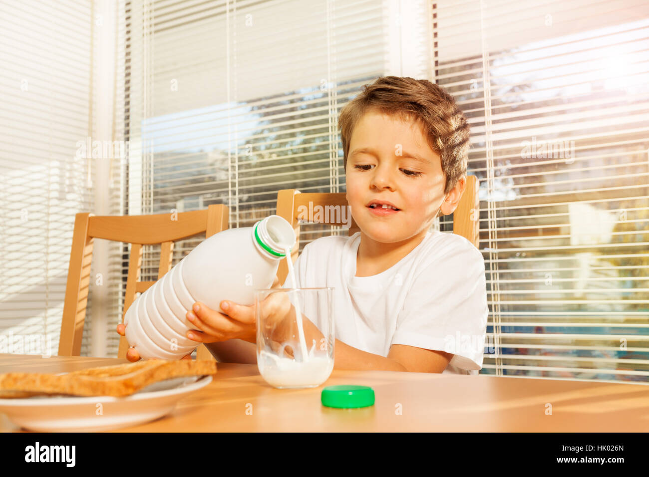 Kid Pouring Milk High Resolution Stock Photography and Images - Alamy