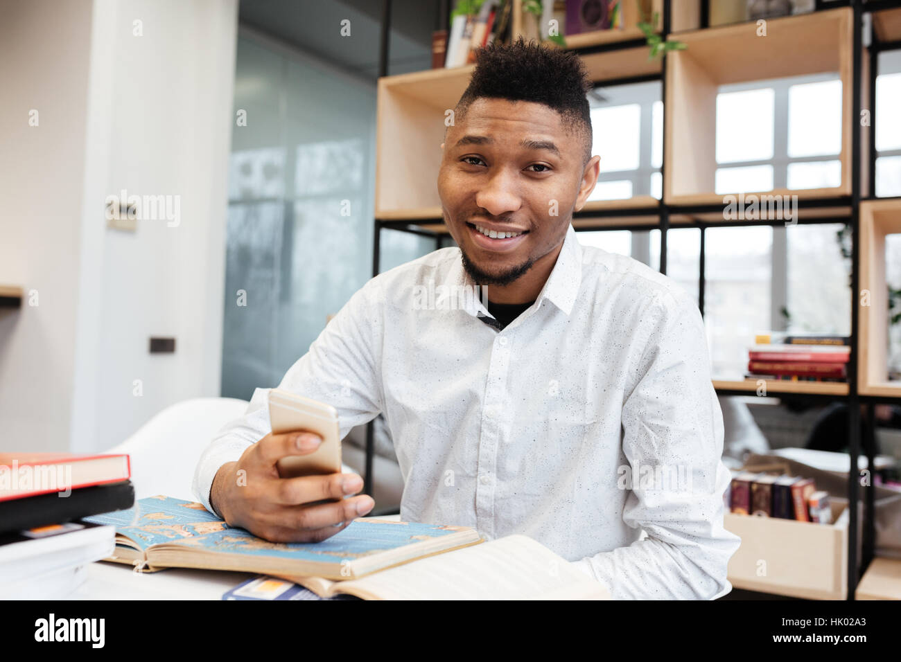Picture of handsome african student in library learning education ...