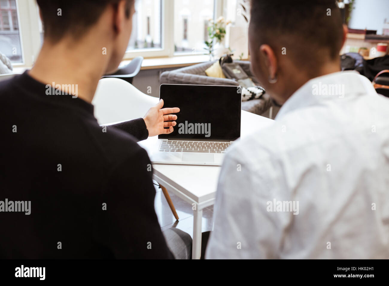 Back view of adult sitting in library hi-res stock photography and ...
