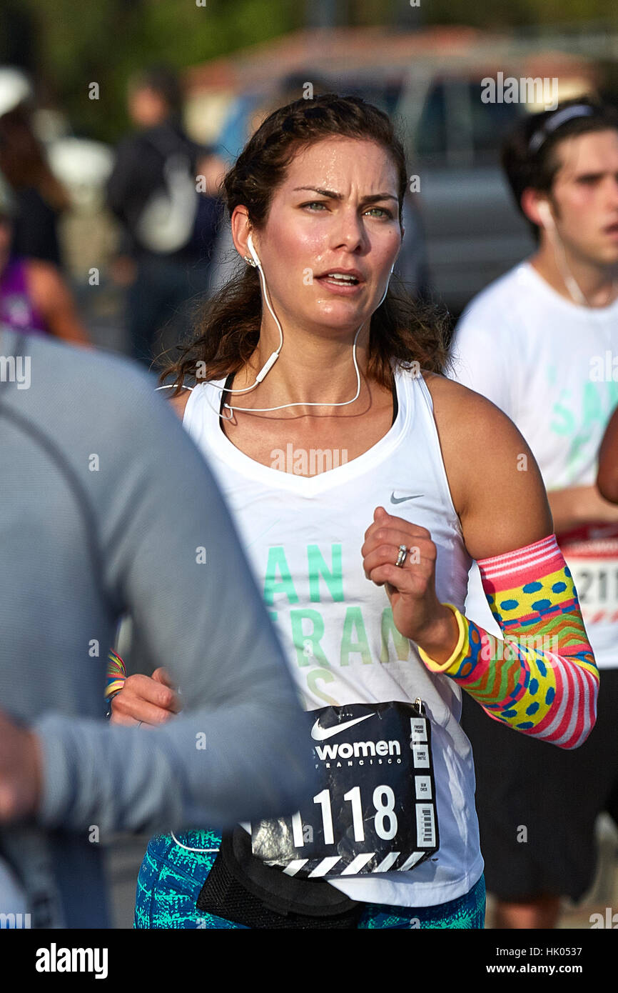 Committed Female Athlete Approaching The Finish Line In The Nike Woman ...