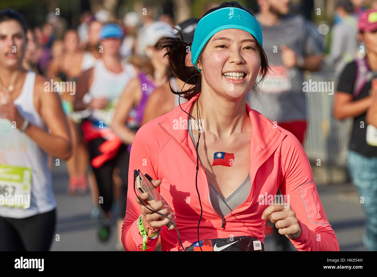 Asian Female Athlete Approaching The Finish Line In The Nike Woman's ...