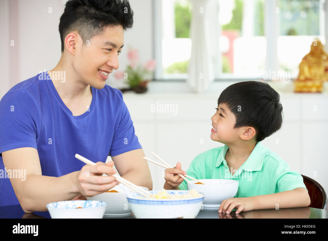 Chinese father and son eating rice hi-res stock photography and images ...